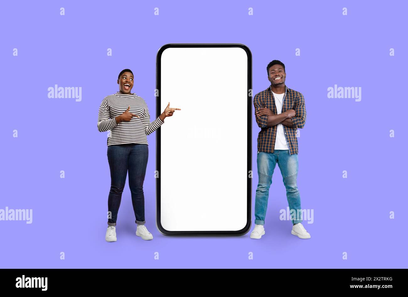 Excited duo beside blank smartphone screen mockup Stock Photo - Alamy