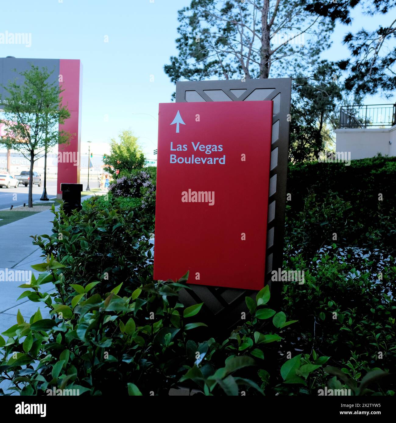 Red sign with white letters and arrow pointing towards Las Vegas ...