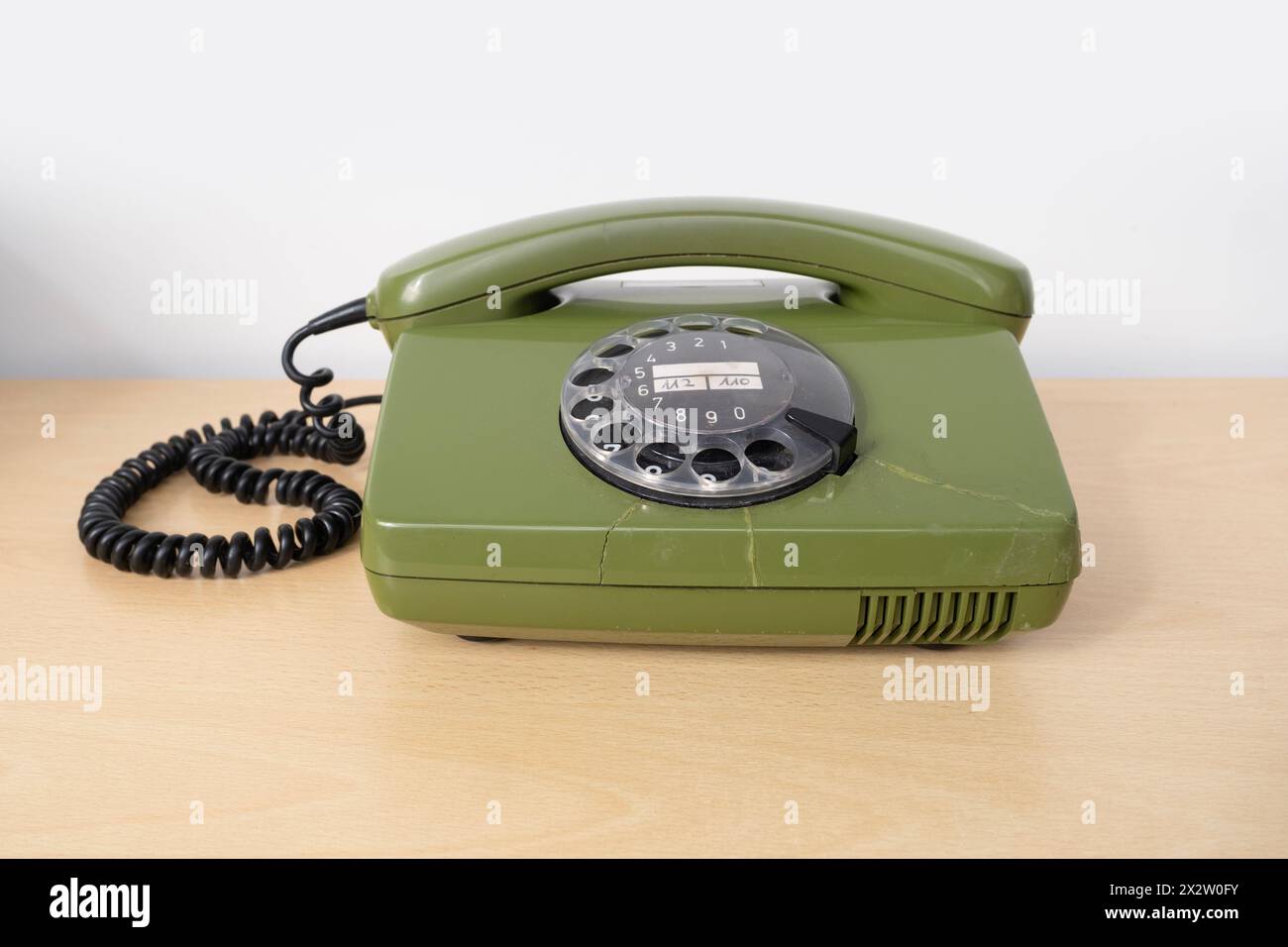 Old green Rotary Telephone with Disc Dial, Old Phone with Cracks ...