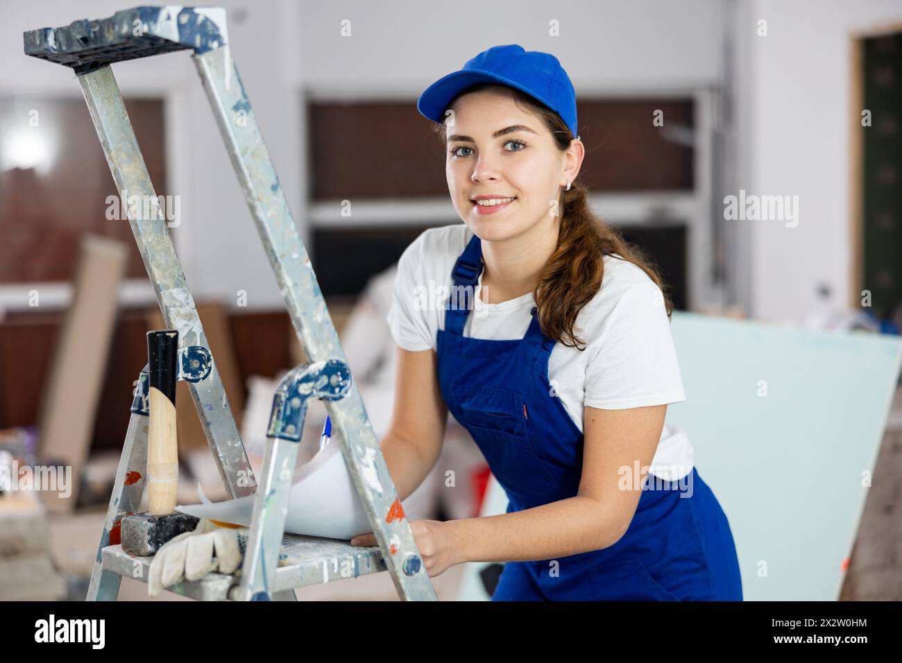 Woman foreman signs an act of acceptance of completed work Stock Photo ...