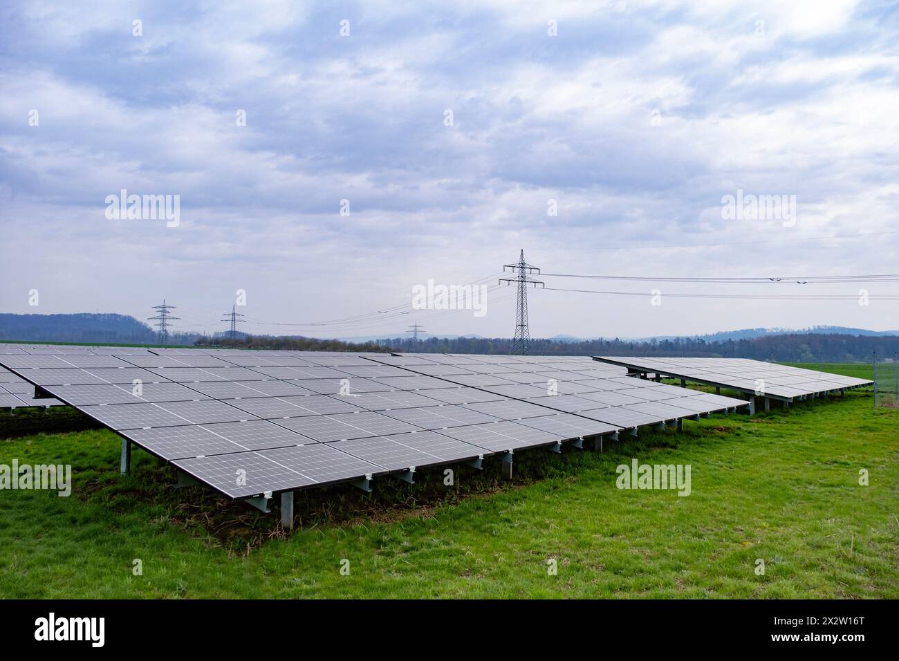 Rows photovoltaic panels stretch across solar farm, capturing sun's ...