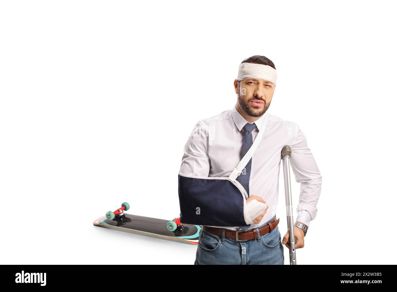 Man with an arm sling and bandage on head leaning on a crutch ...