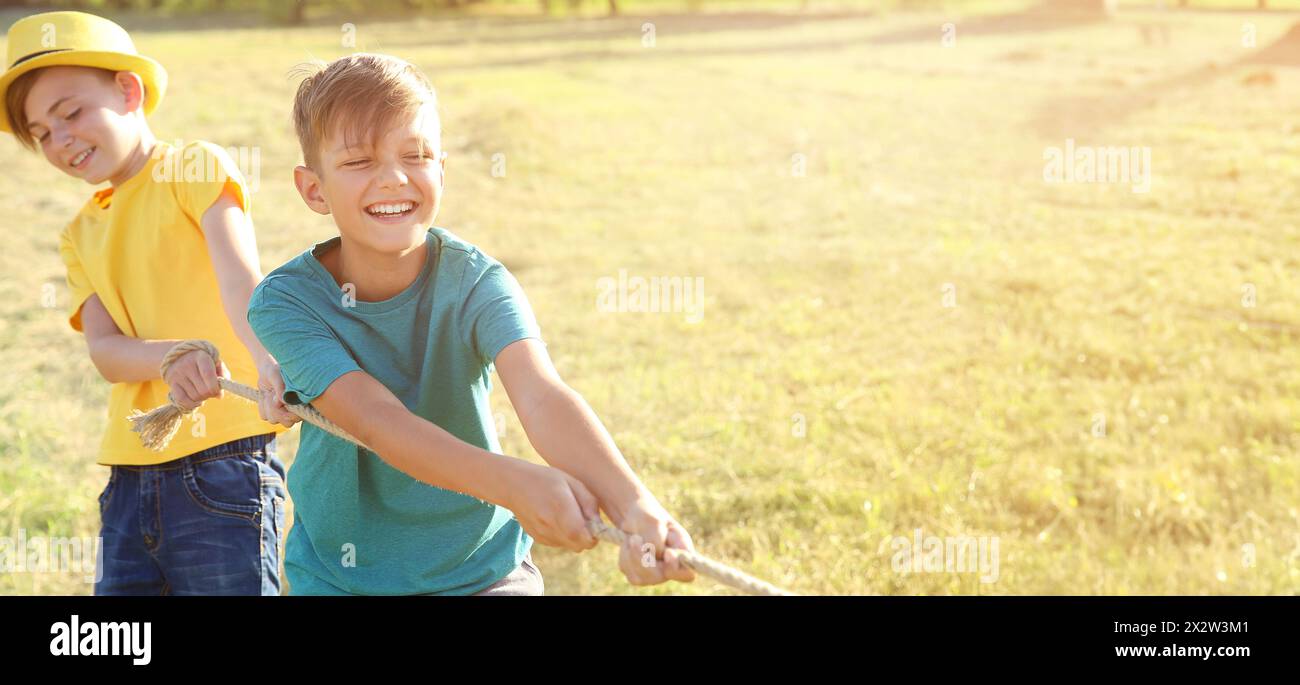 Boys pulling rope at summer camp Stock Photo - Alamy