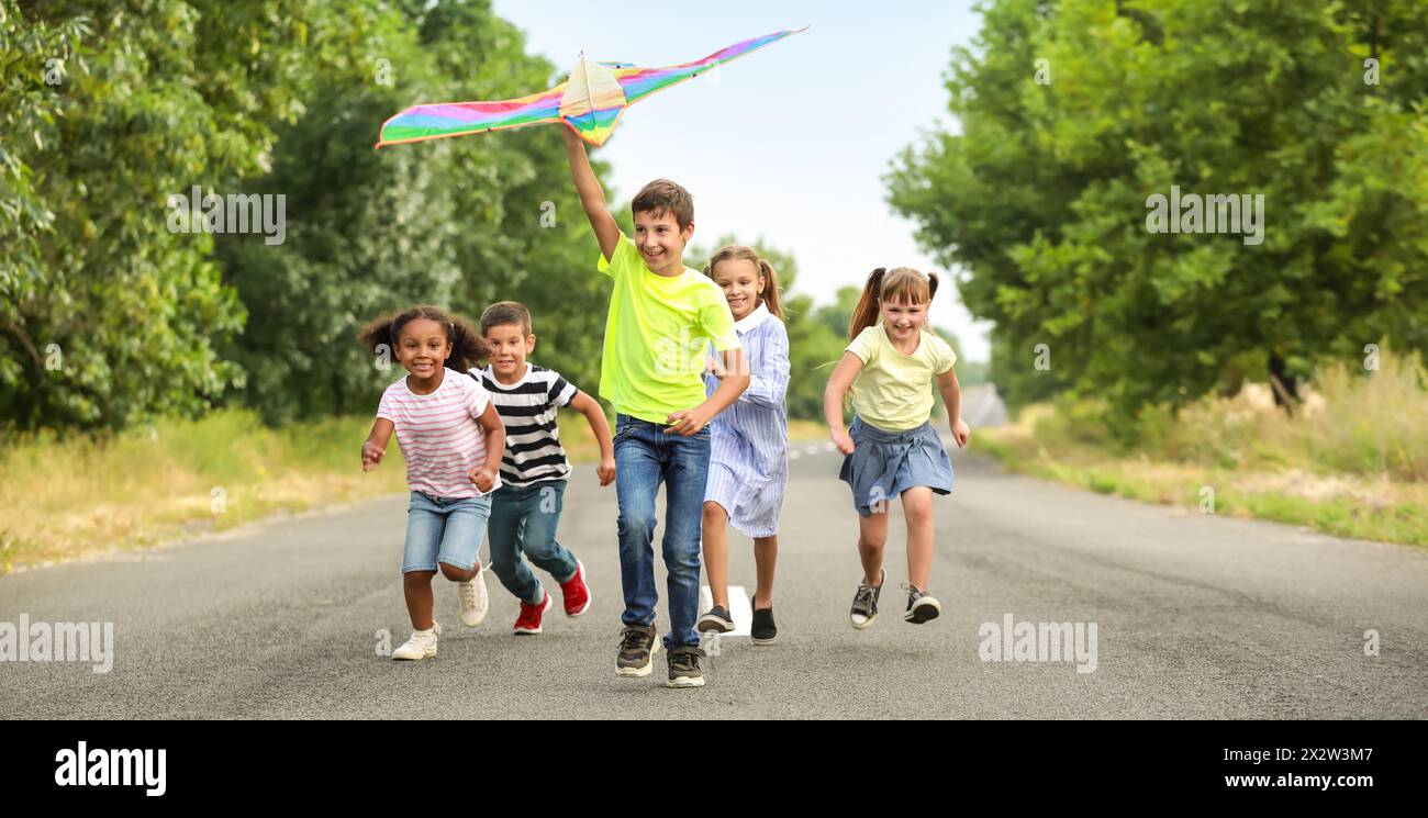 Little children flying kite outdoors Stock Photo - Alamy