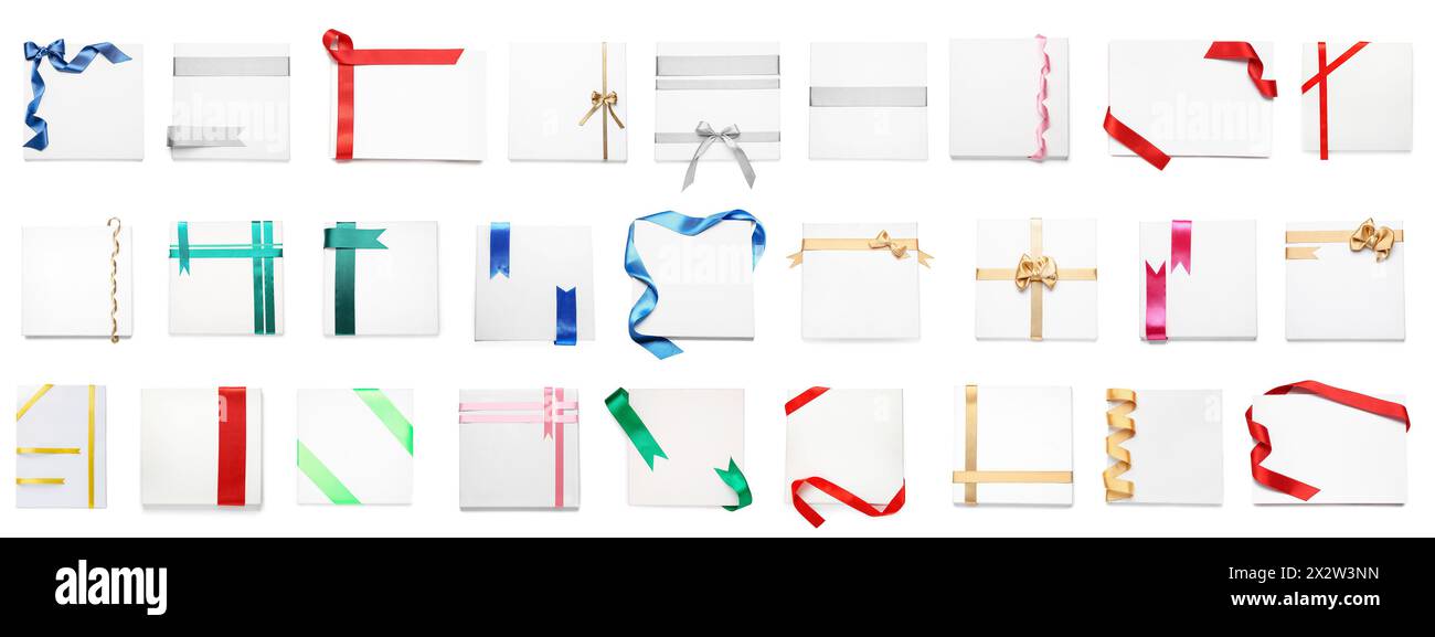 Collection of color ribbons with blank posters on white background ...