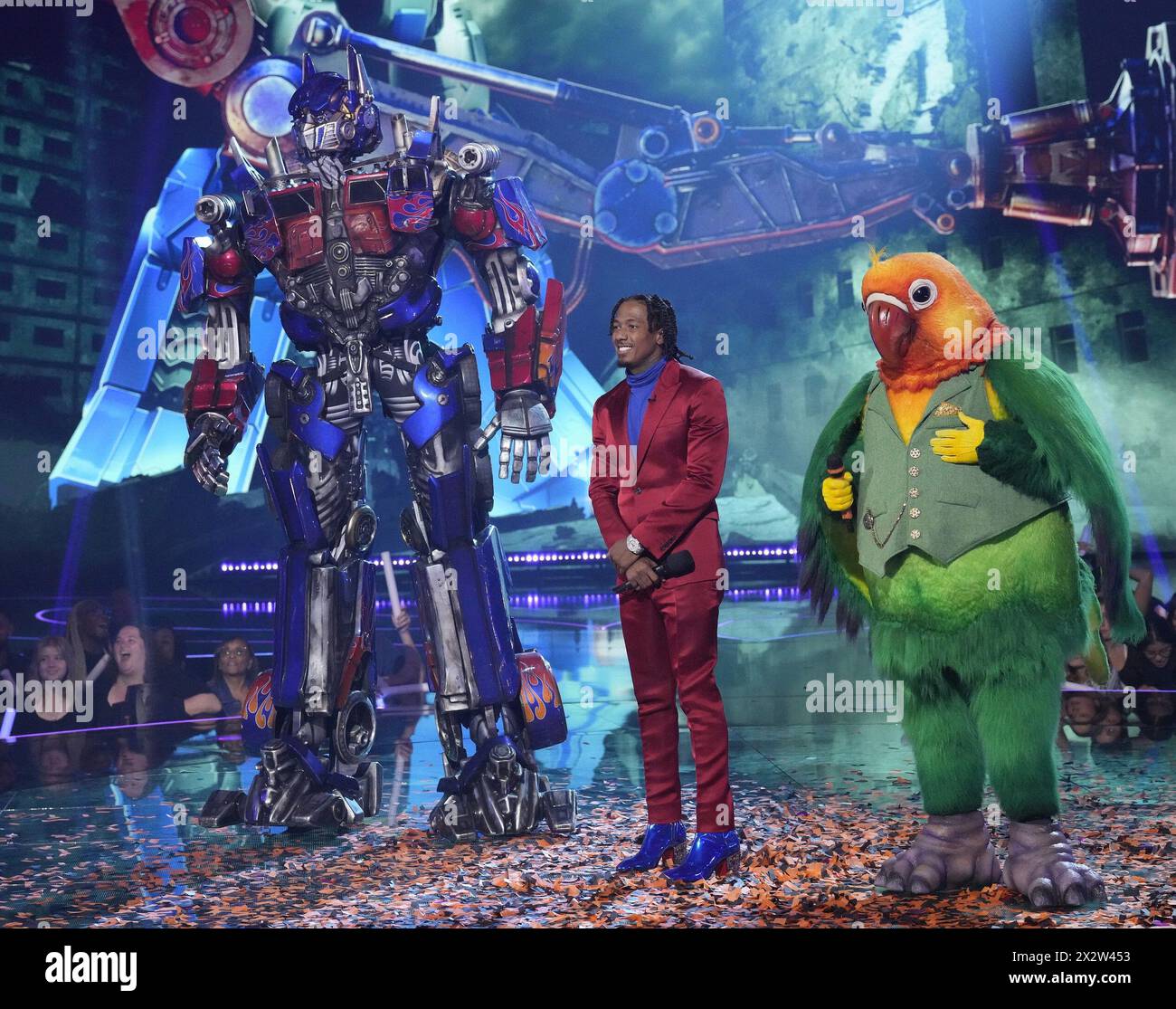 THE MASKED SINGER, from left: host Nick Cannon, Lovebird (revealed as ...