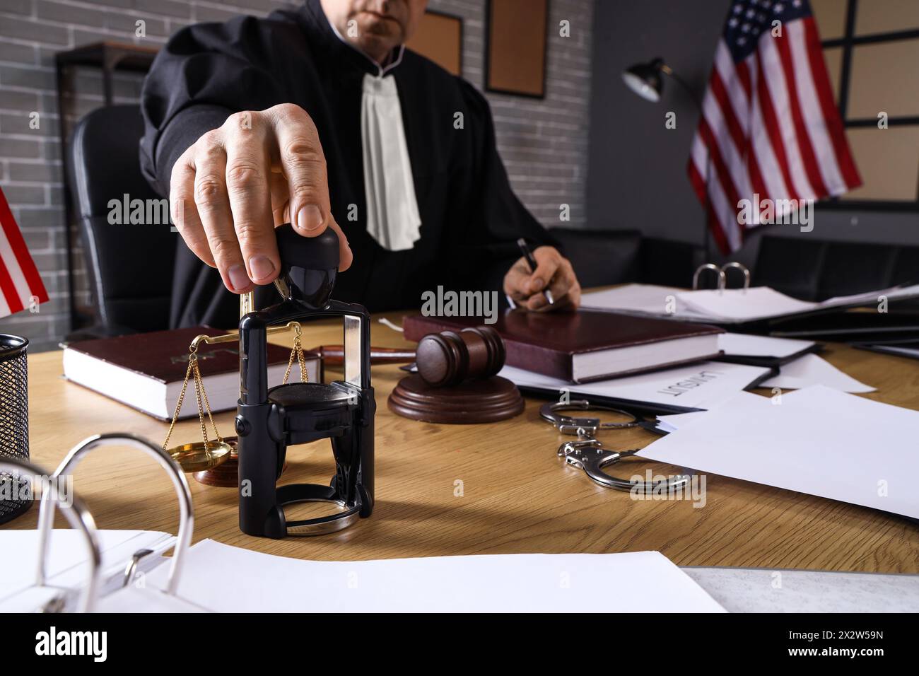 Mature male judge sitting hi-res stock photography and images - Alamy