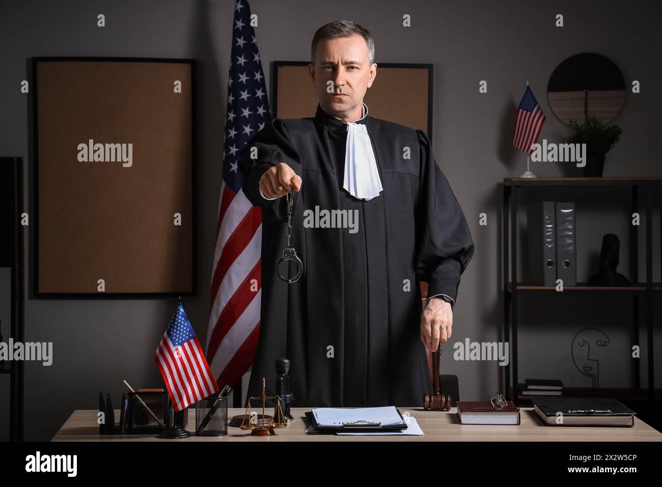 Man in handcuffs in courtroom hi-res stock photography and images - Alamy