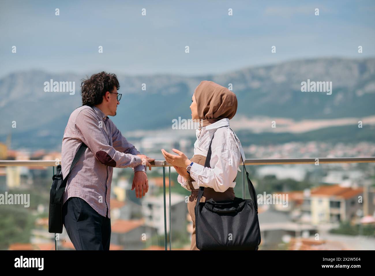 After a day at the office, a business man engages in conversation with ...