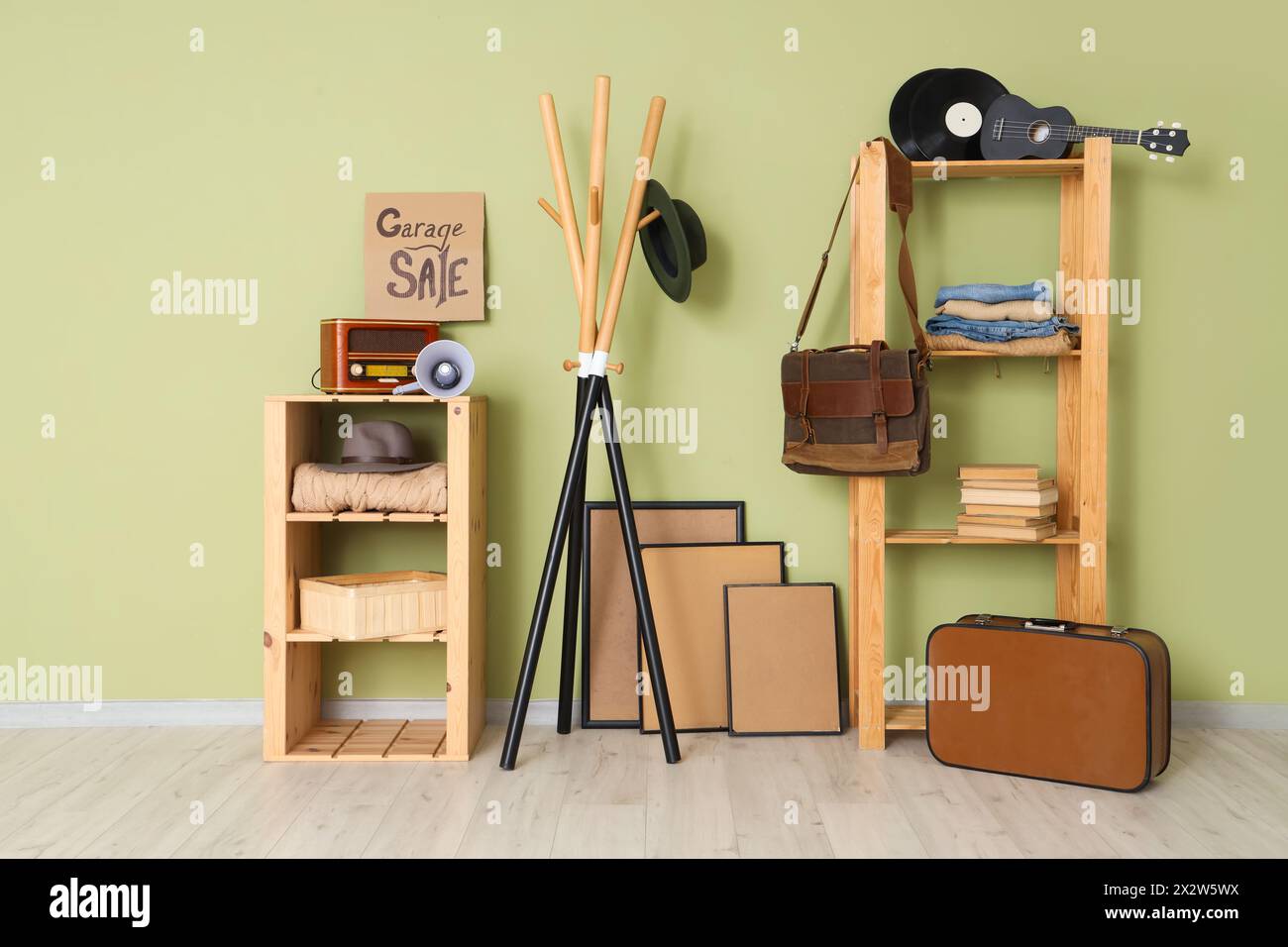 Interior of room with shelf units and unwanted stuff for garage sale ...