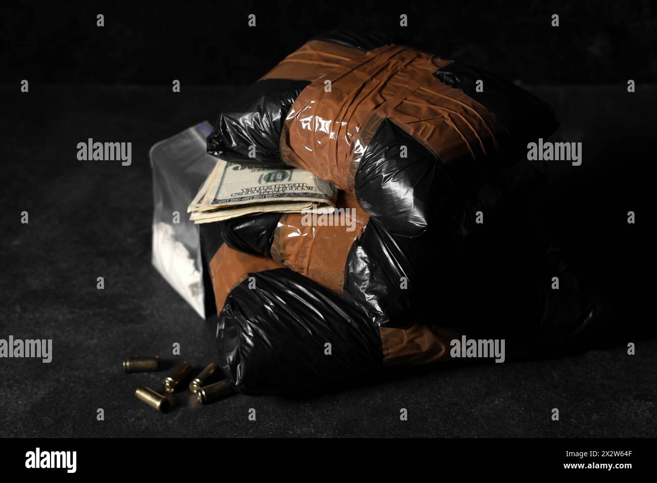 Drug packages with money on dark background Stock Photo - Alamy