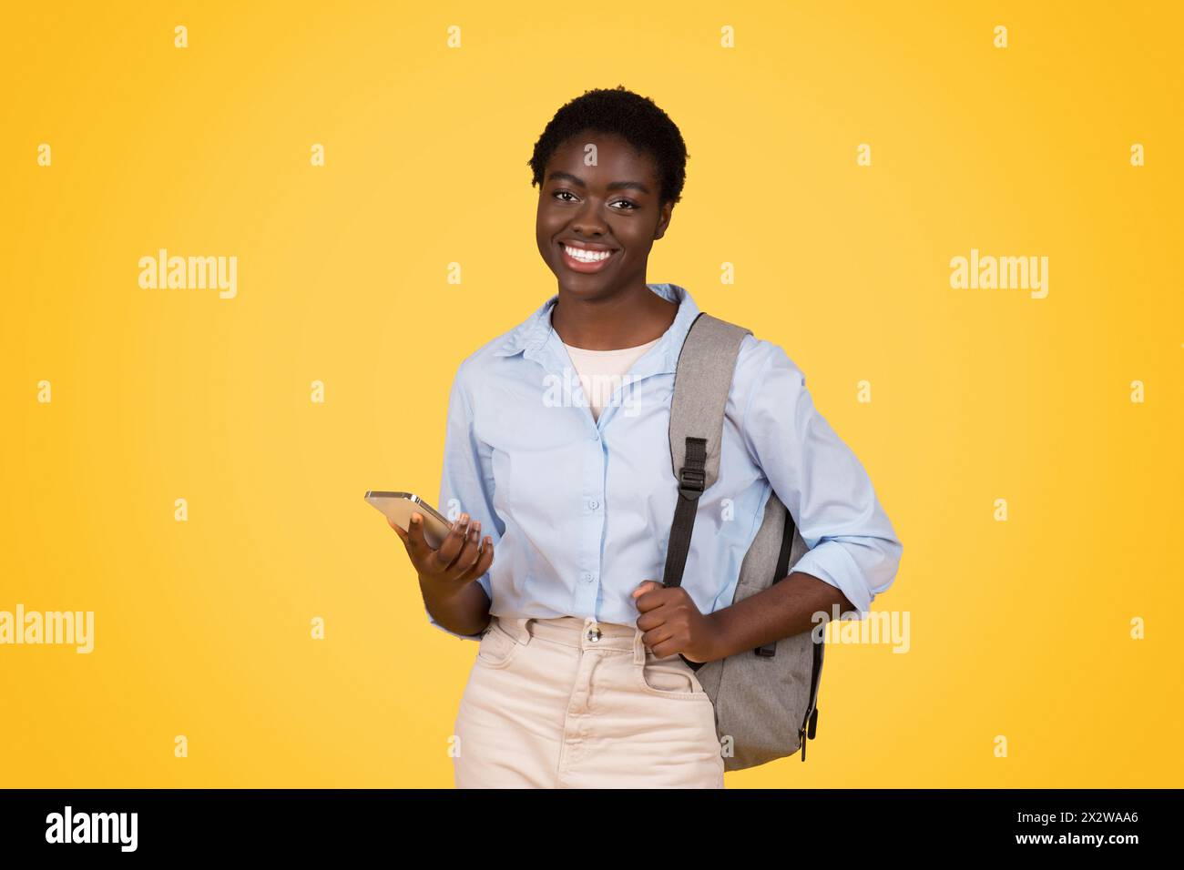 Generation Z woman with phone and bag Stock Photo - Alamy