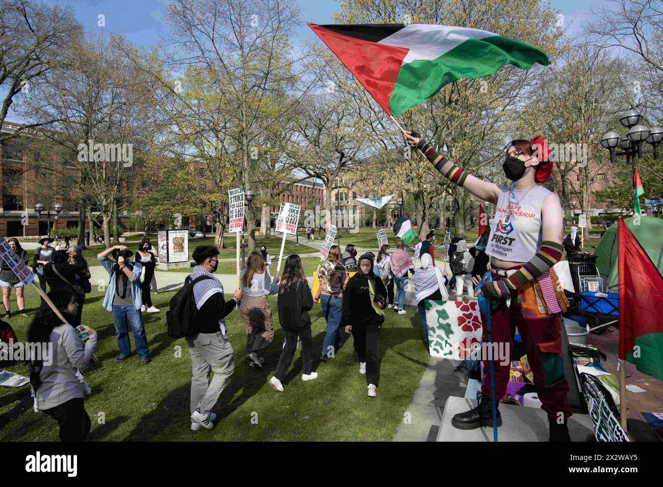 Ann Arbor, Michigan, USA. 22nd Apr, 2024. A person waives a Palestinian ...