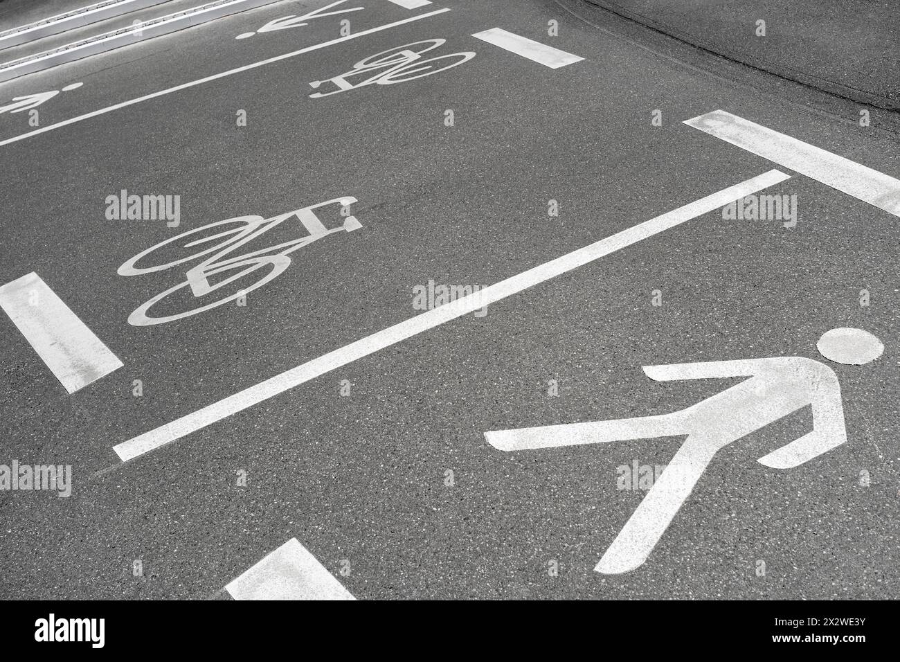 Pedestrian and cyclist lane sign marking on bikeway walkway crossing ...