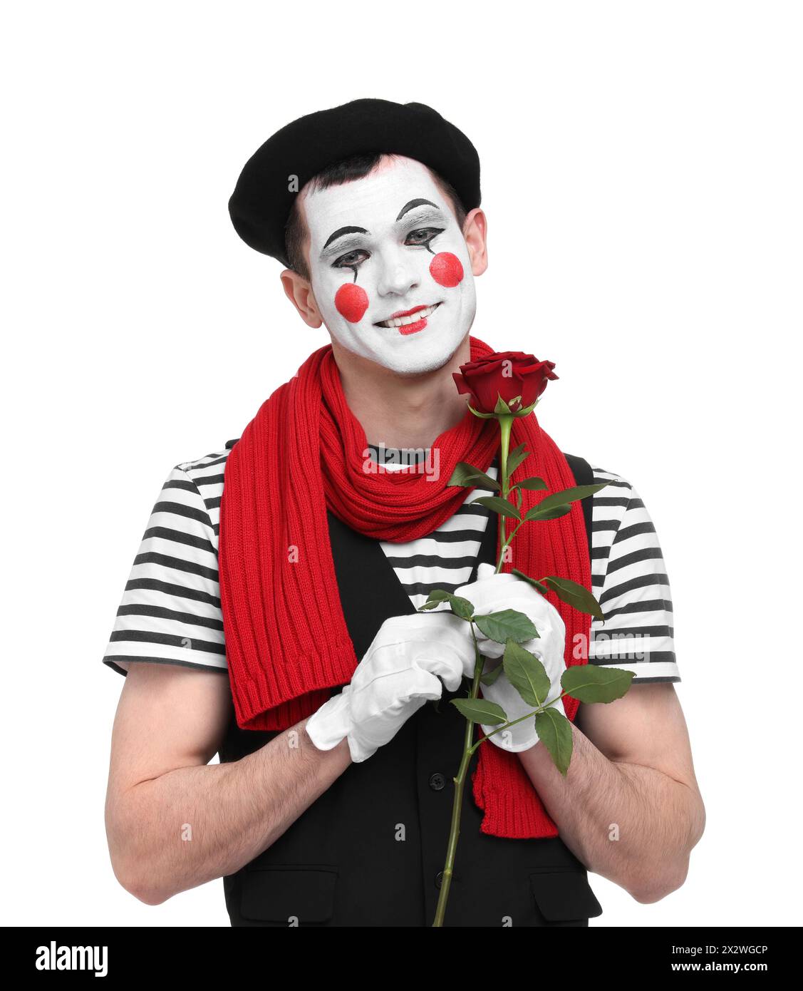 Funny mime artist with red rose on white background Stock Photo - Alamy