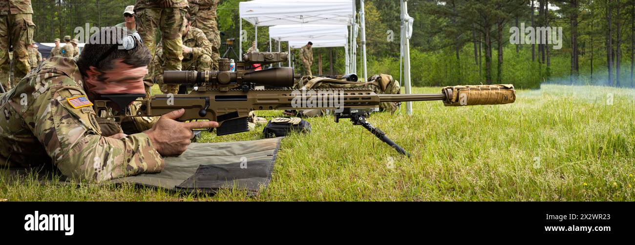 A member of the 20th Special Forces Group (Airborne) fires a MK-22 ...