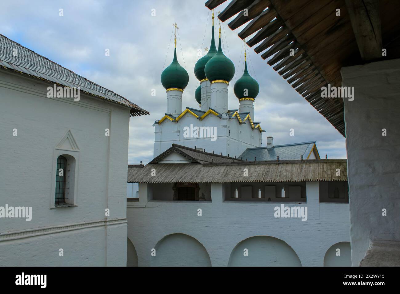 White stone church on the territory of the Rostov Kremlin, Russia. Blue ...