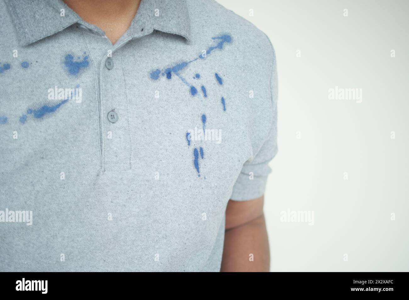 shirt with blue ink stain Stock Photo - Alamy