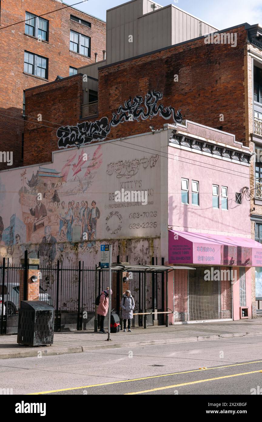 Vancouver, Canada - Mar 5 2024: A cute pink-colored building with other ...