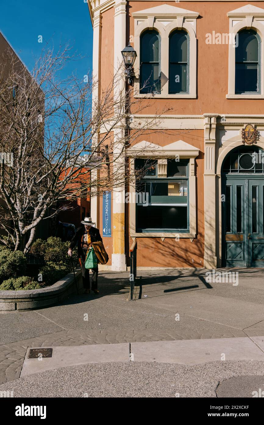 Victoria, Canada - Mar 18 2024: A senior man with a cane and white ...