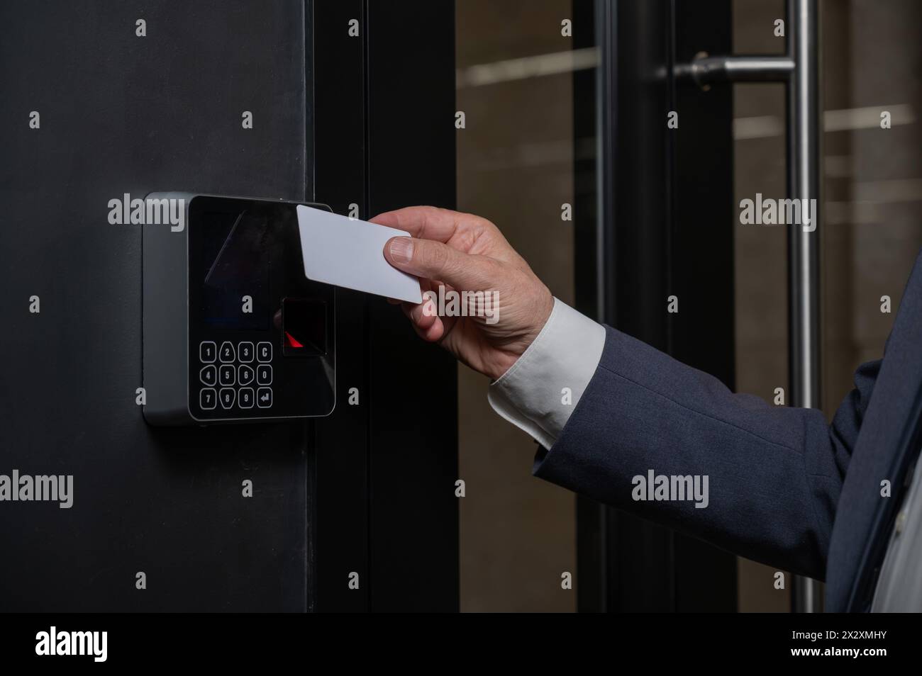 A man opens the door with a card. Modern electronic lock. Keyless Entry ...