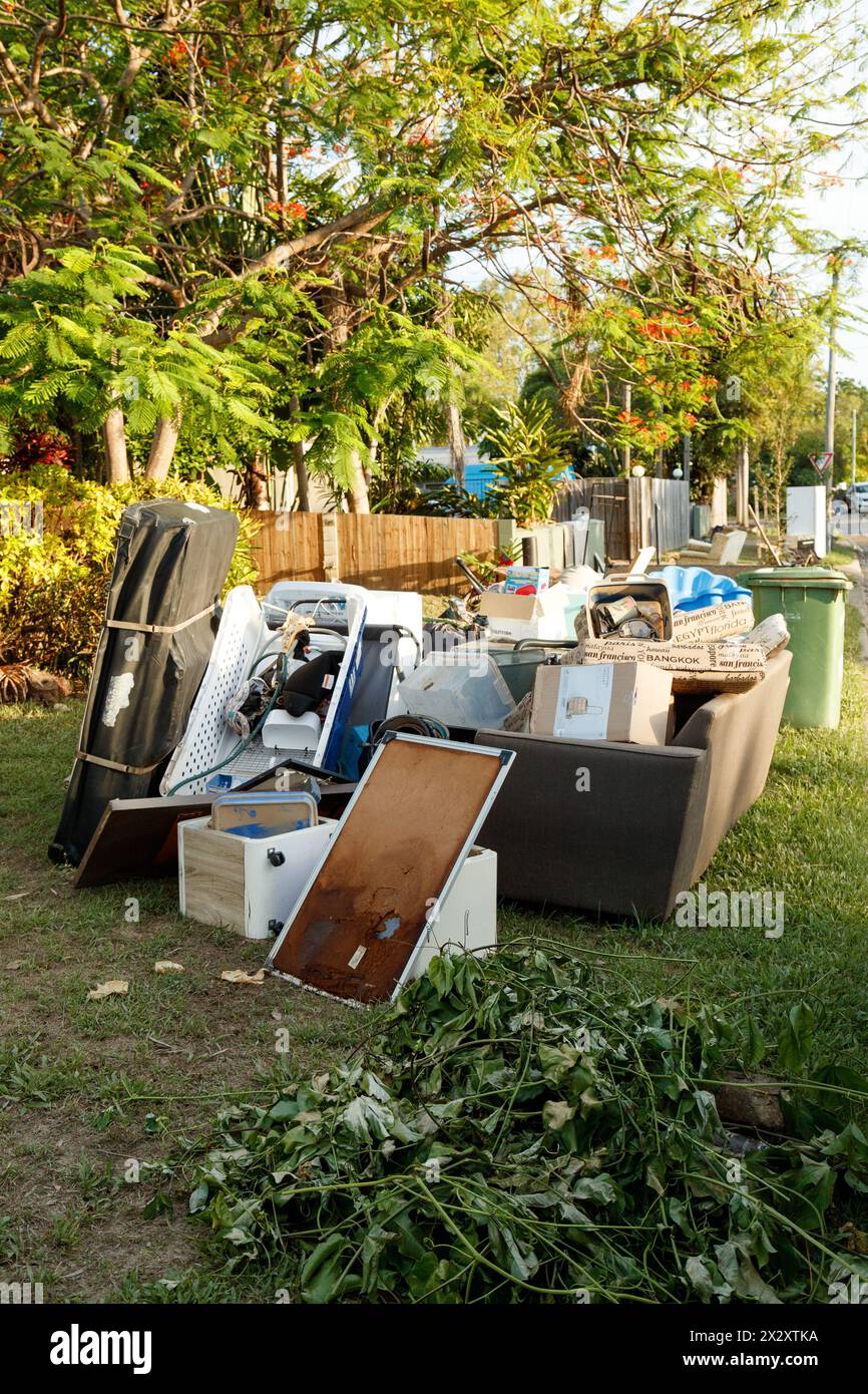 Debris lines the streets of Holloways Beach on 21 December 2023, as the ...