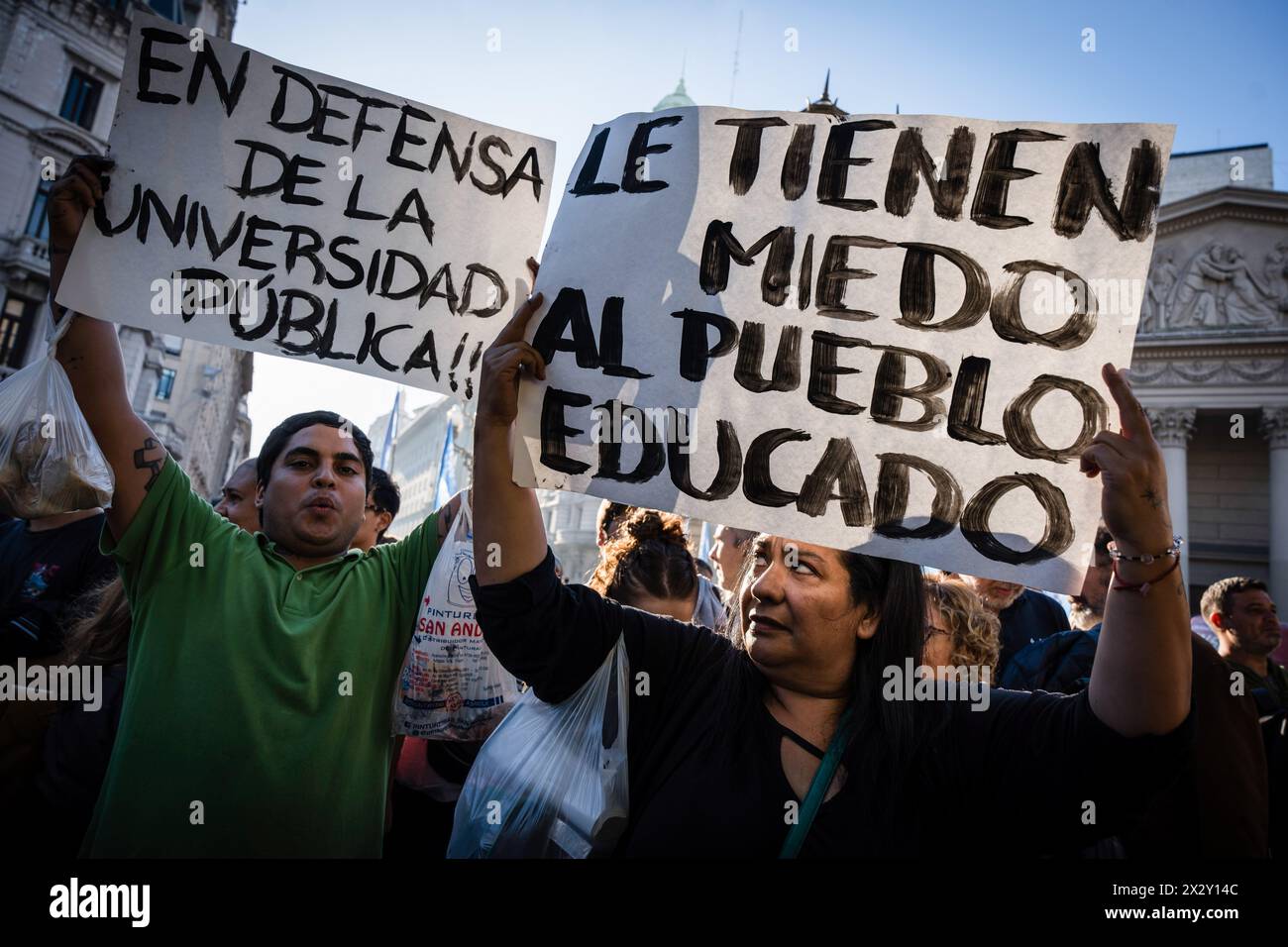 Protesters hold placards during the demonstration. Mobilization of ...