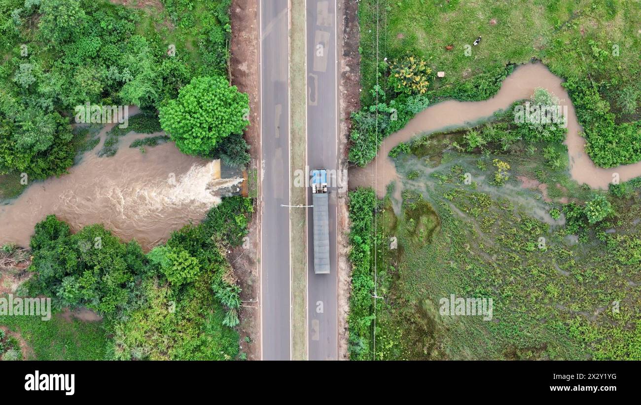 Truck on highway passing bridge over stream Stock Photo - Alamy