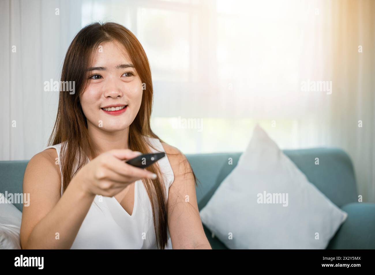 Beautiful female person look movie holding remote controller watching ...