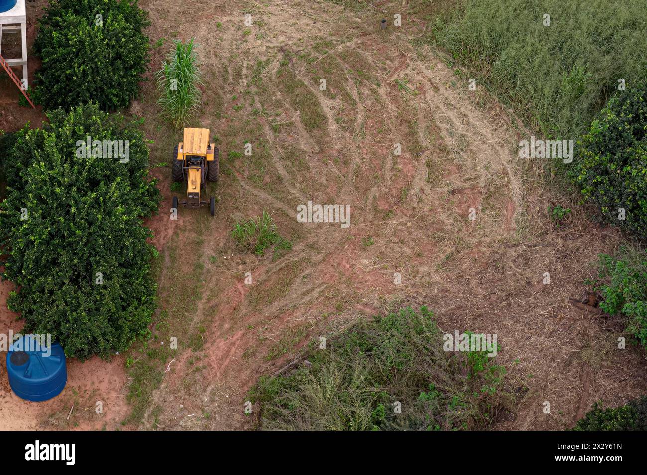 aerial image of rural farm space with old tractor Stock Photo - Alamy