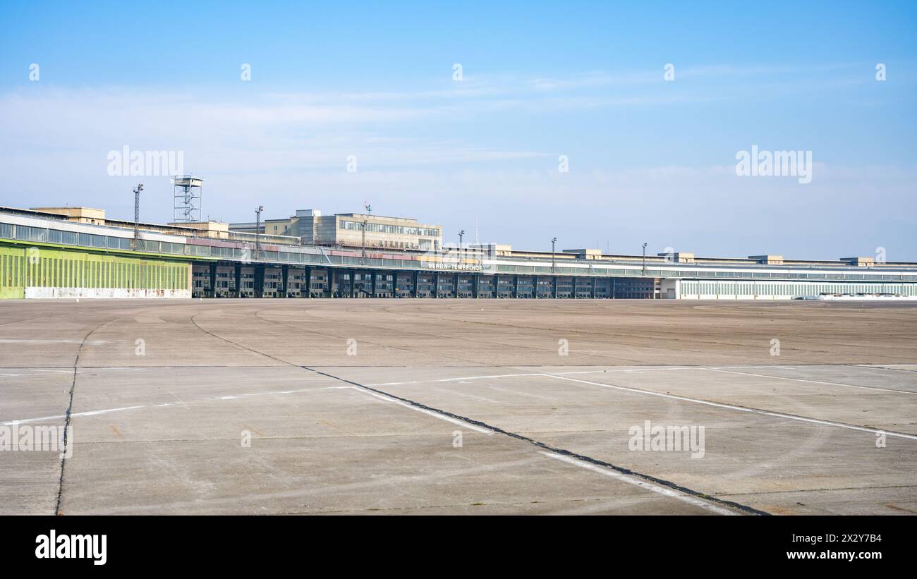 Clear blue skies over the historic Berlin Tempelhof Airport in Germany, showcasing the vast ...