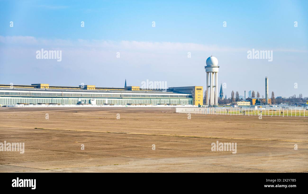 The intricate metal spiral ramp leading upwards inside the modern glass ...