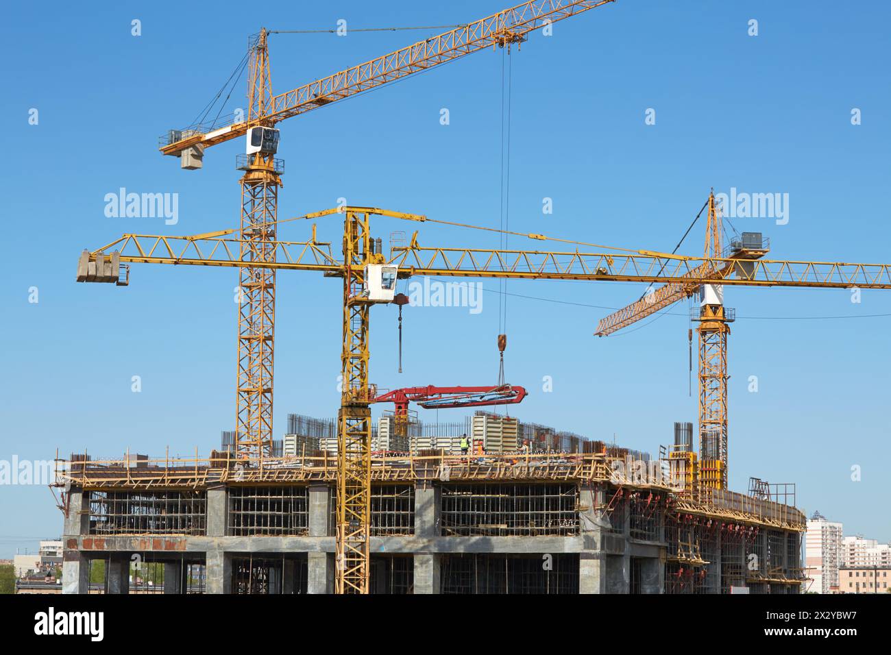Tower cranes at construction site Stock Photo - Alamy