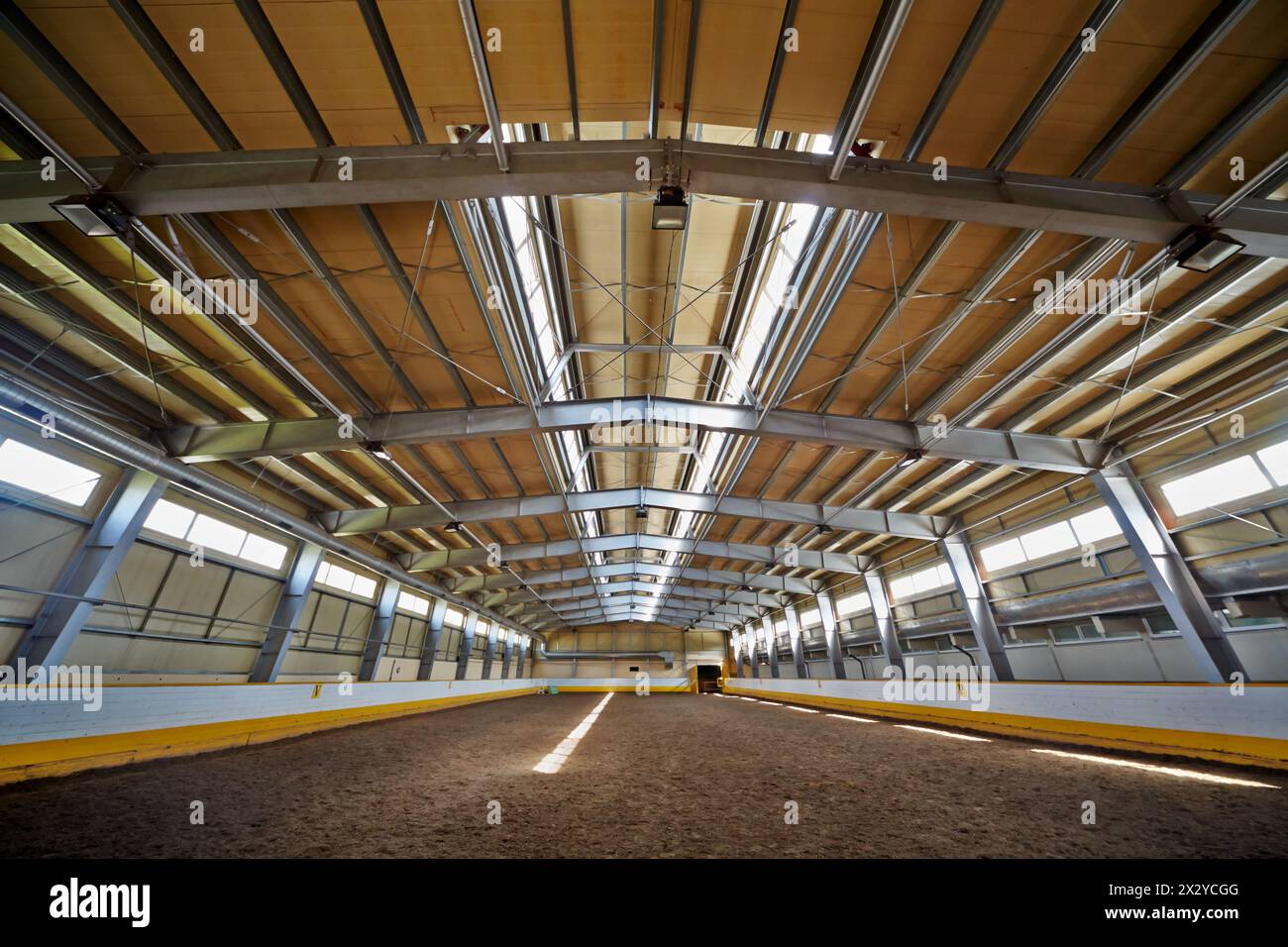 Indoor riding hall with sandy covering Stock Photo - Alamy