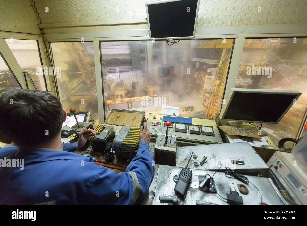 Rolling mill control cabin inside with worker Stock Photo - Alamy
