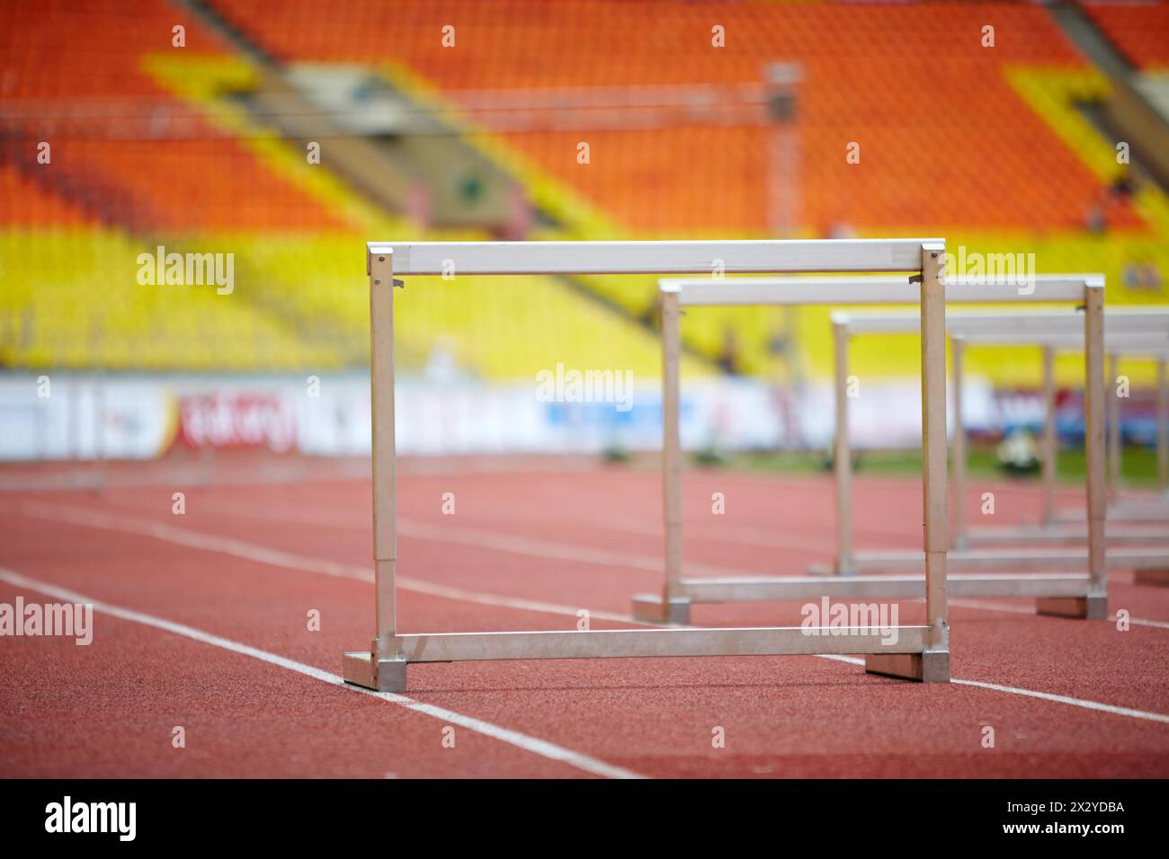 Hurdles on race tracks for obstacle race Stock Photo - Alamy