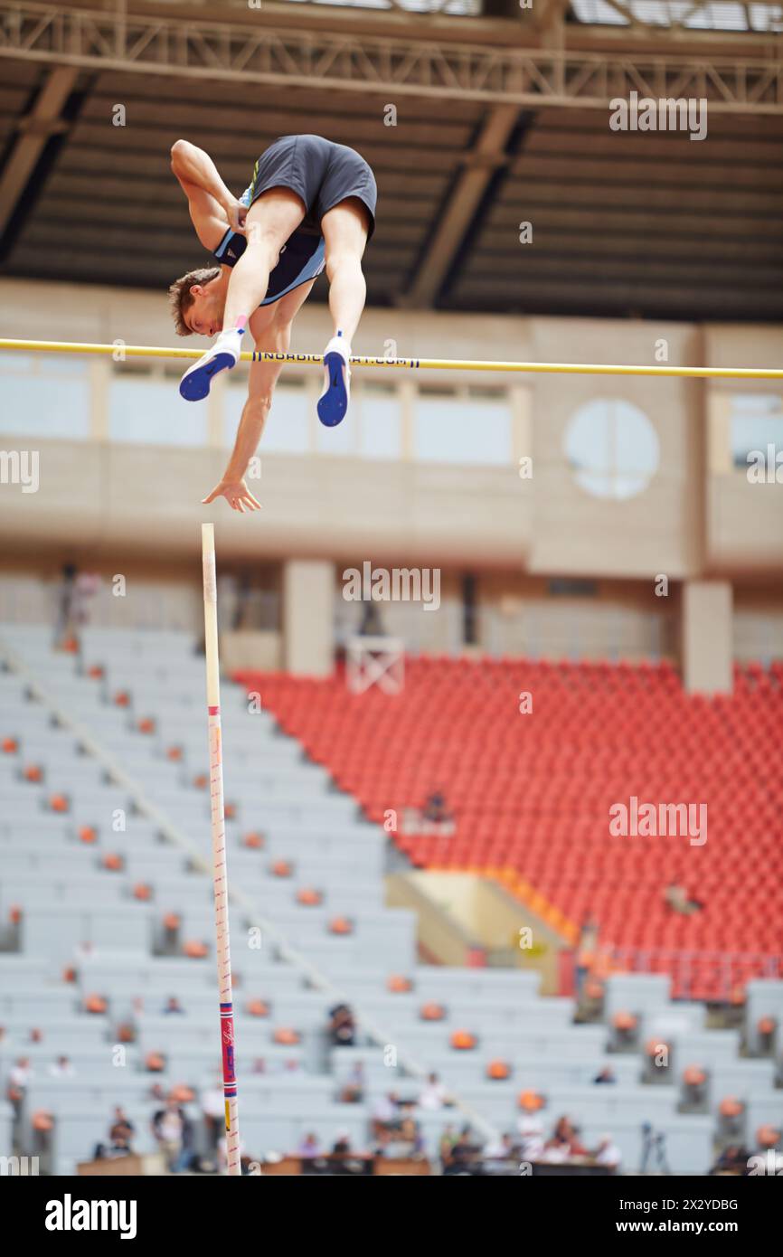 MOSCOW - JUN 11: Pole vaulter goes over bar at Grand Sports Arena of ...