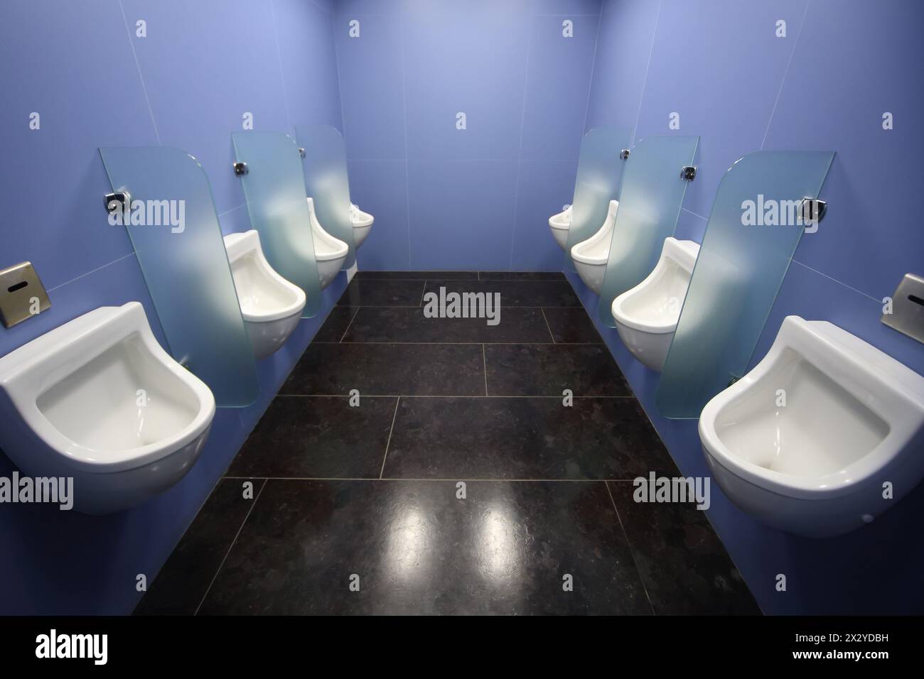 Interior of the mens room with urinals Stock Photo - Alamy