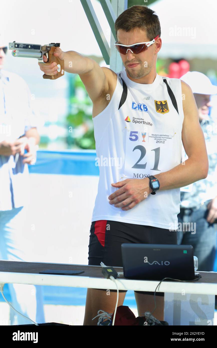 Young man shoots rifle in hi-res stock photography and images - Alamy