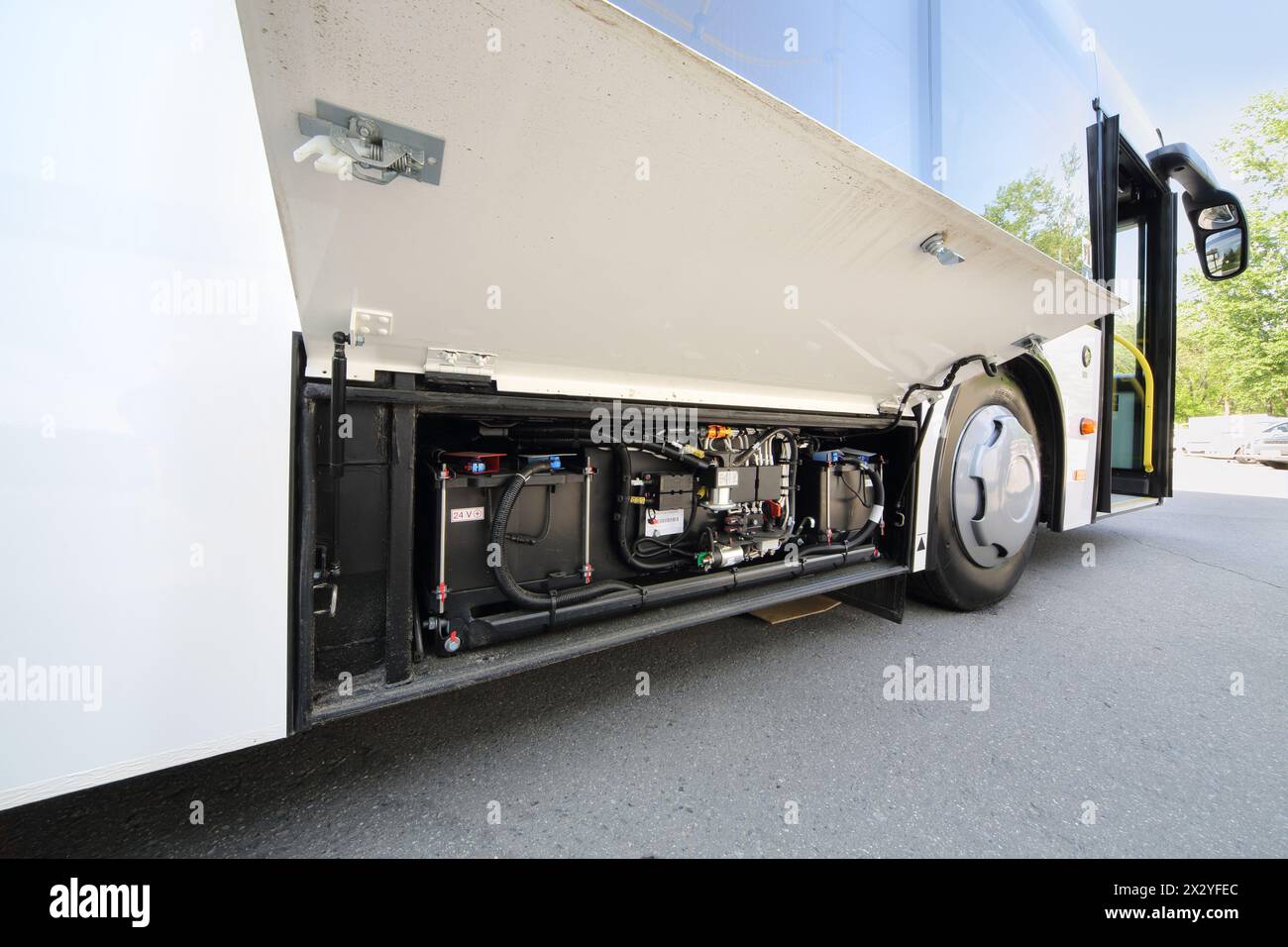 Battery of white city bus with hybrid traction at sunny day outdoor ...