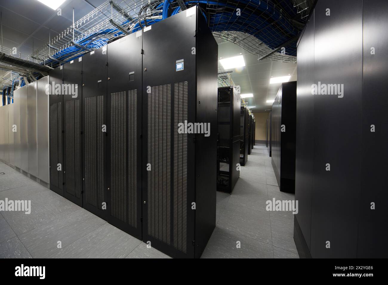 Server room with the telecommunication racks and lots of blue and black ...