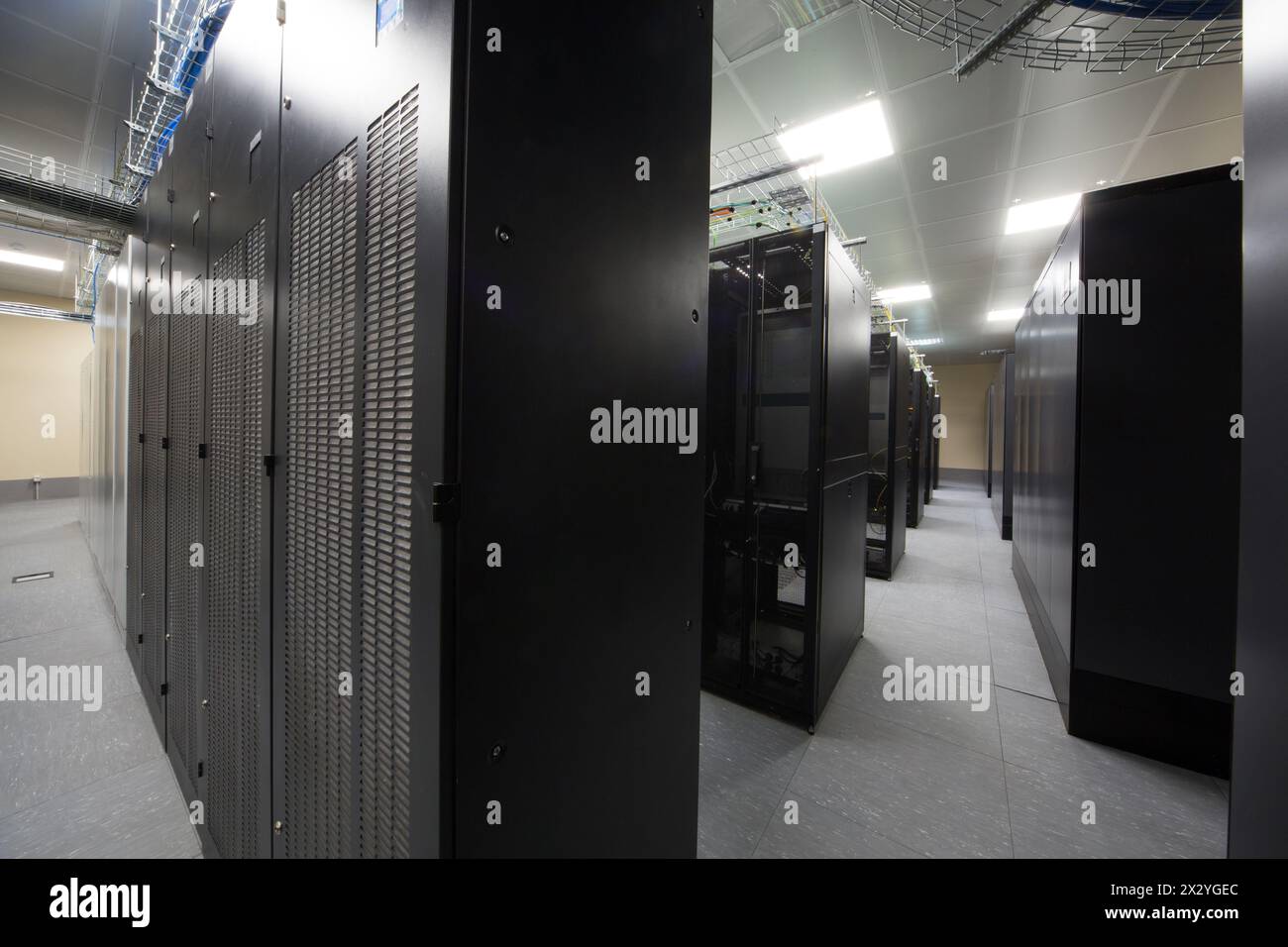 Telecommunication racks in the server room with lots of cables Stock ...