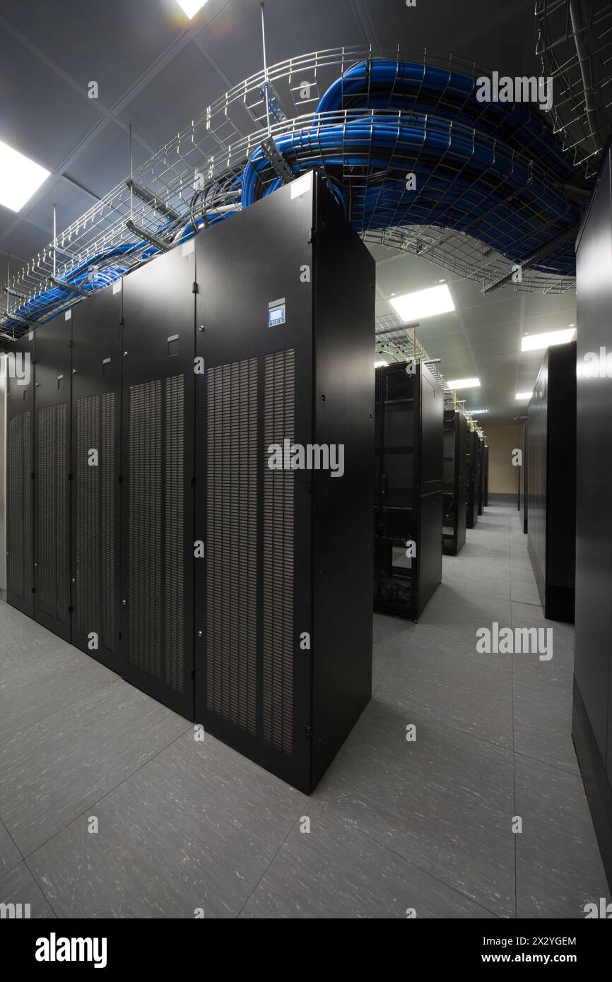 Telecommunication racks in the server room with lots of blue and black ...