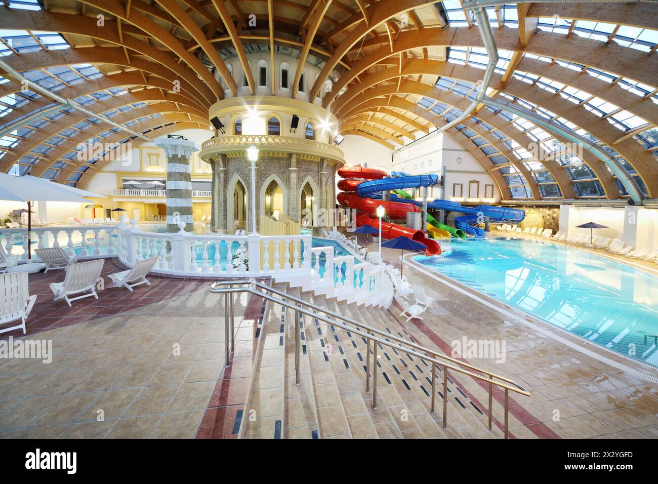 MOSCOW - JUNE 24: Stairs, swimming pools and water slides in water park ...