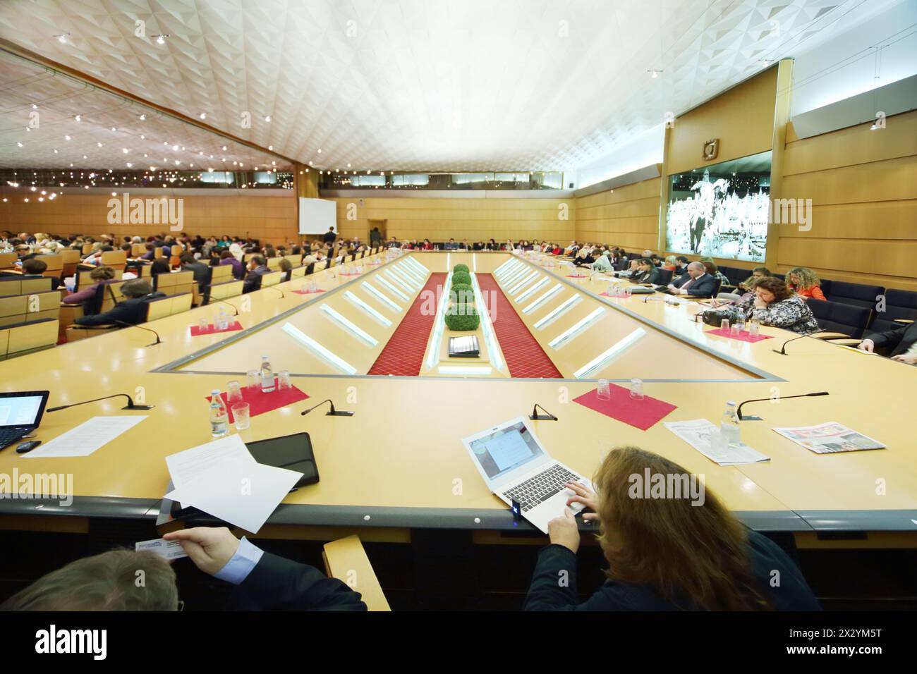 MOSCOW - NOVEMBER 13: Meeting participants sit at long table at Event ...