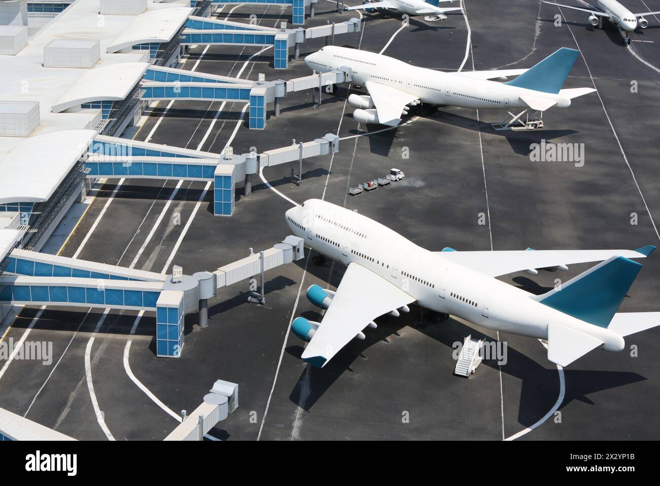 Models of modern white aircraft standing at miniature airport Stock ...