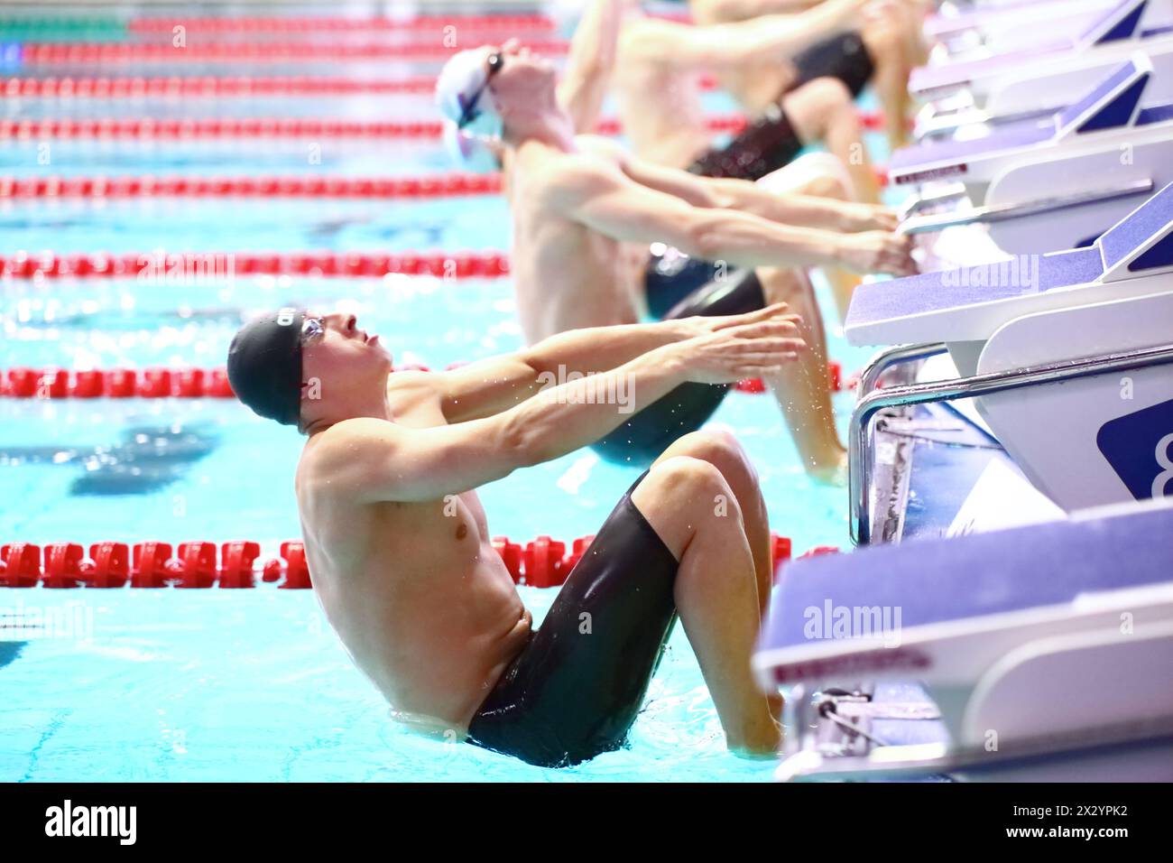 MOSCOW - APR 20: Swimmers at the start of jumping into the water in the ...
