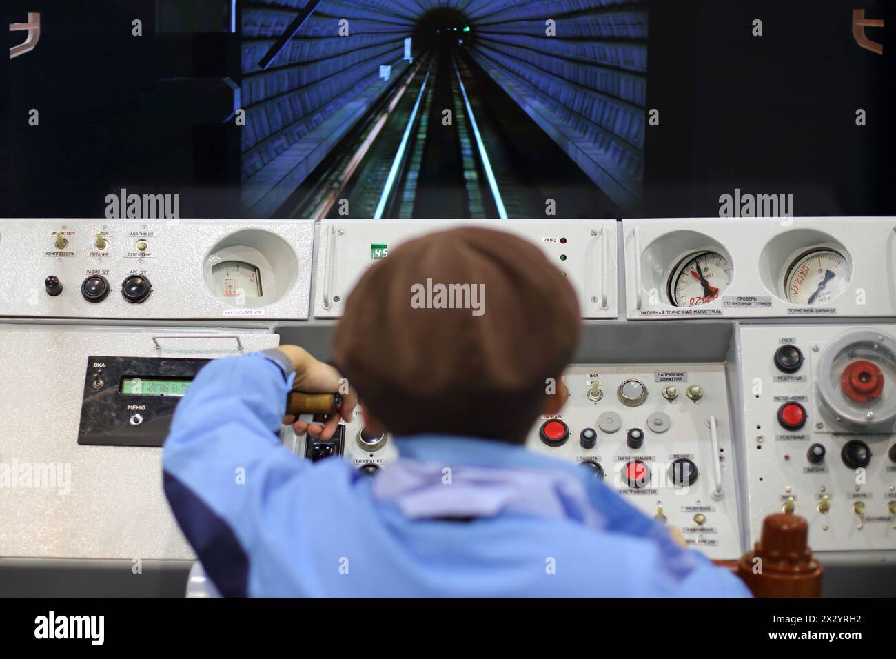 Man on simulator control panel subway car Stock Photo - Alamy