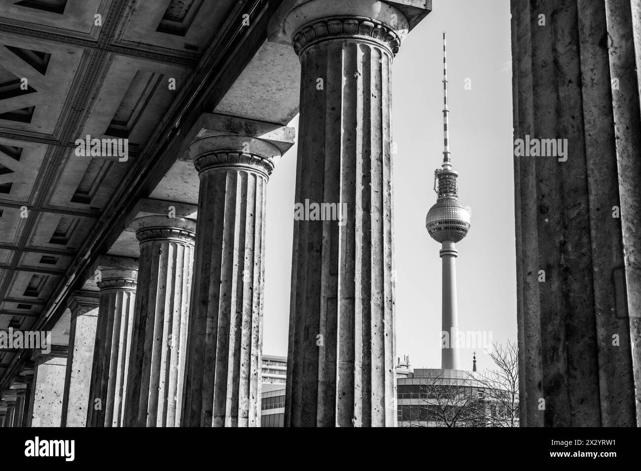 The Berlin TV Tower stands tall, framed by the classical columns of a ...