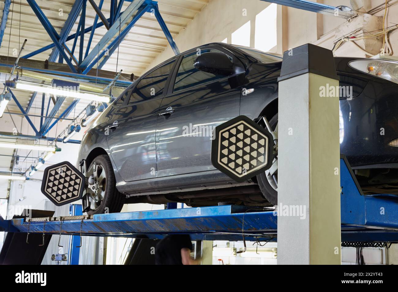 MOSCOW - AUG 22: Car on stand with sensors on wheels for wheels ...